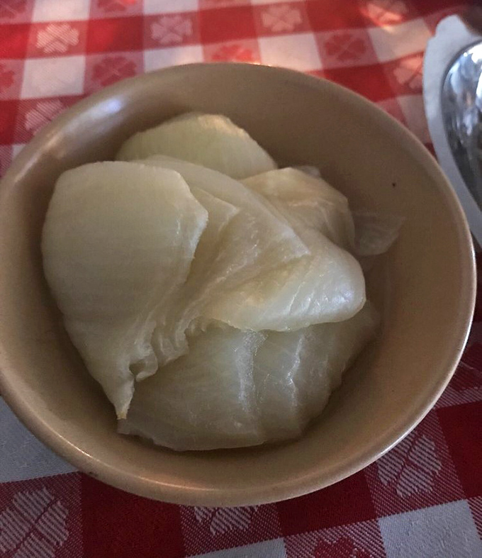 The humble onion, transformed. These tender white petals have been coaxed into submission through slow cooking &ndash; a steakhouse delicacy.