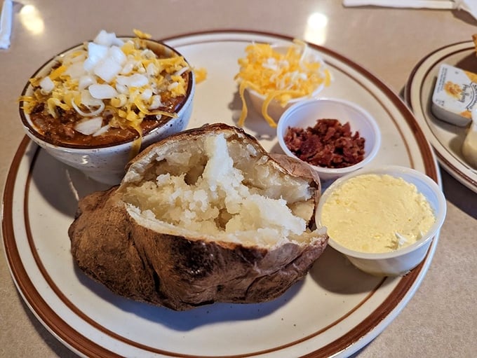 A loaded baked potato that makes you wonder why anyone bothers with fancy side dishes when perfection already exists.