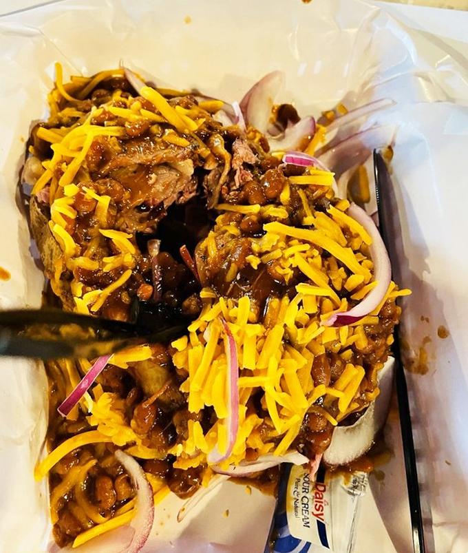A loaded baked potato that's essentially a meat delivery system disguised as a vegetable. Nobody's complaining about this delicious deception.