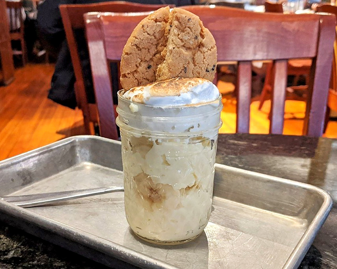Banana pudding in a mason jar topped with a cookie crown. Nostalgia in dessert form that would make your grandmother simultaneously proud and competitive.