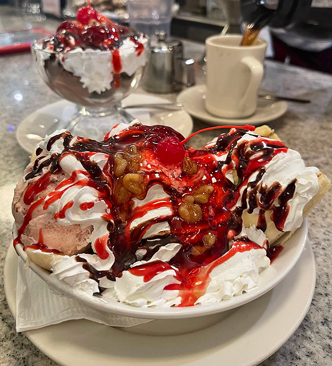 This isn't just a banana split&mdash;it's a dessert carnival with whipped cream mountains, syrup rivers, and a cherry on top playing ringmaster.