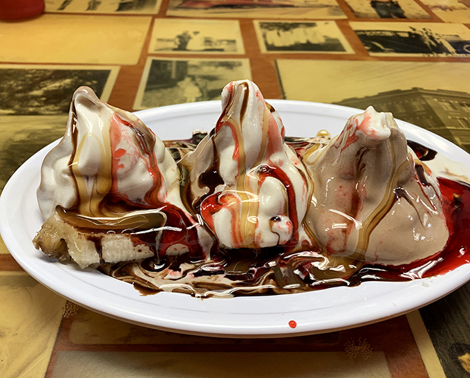 This banana split isn't just dessert, it's an event &ndash; three peaks of ice cream drizzled with enough toppings to make your dentist weep.