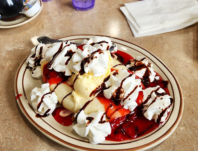 This banana split isn't just dessert&mdash;it's performance art with whipped cream standing ovations and chocolate drizzle encore calls.