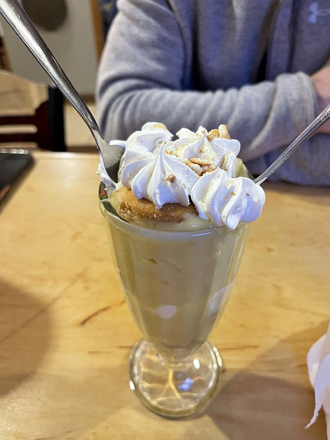 This banana pudding isn't just dessert—it's the sweet, creamy finale your barbecue journey deserves, topped with a cloud of whipped cream.