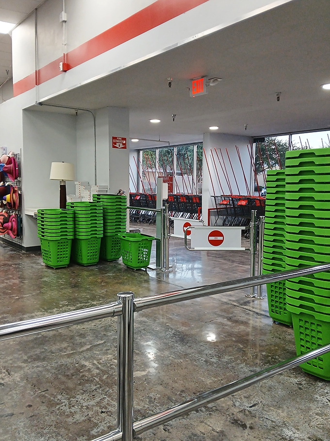 The iconic green shopping baskets stand ready like eager caddies, prepared to help you haul home more treasures than you planned.