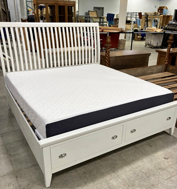 This pristine white bed frame with storage drawers proves that "secondhand" and "sophisticated" aren't mutually exclusive terms in the thrift universe.