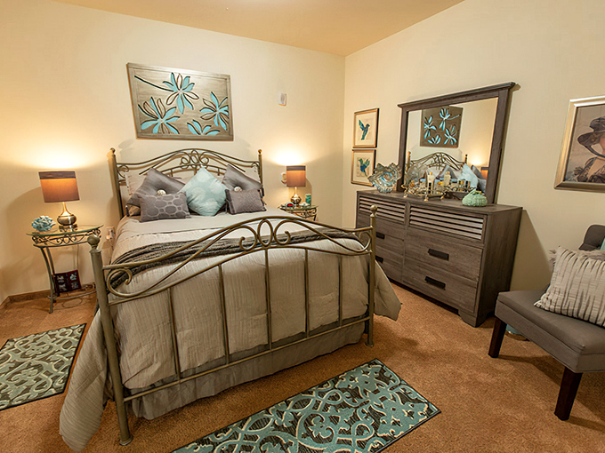 A bedroom that says "I've retired from work, not from style." Tranquil blues and thoughtful design create a personal sanctuary.