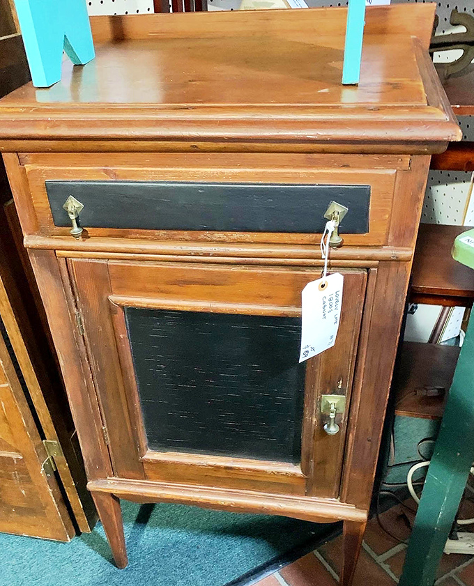 This weathered wooden cabinet with its original hardware isn't just furniture&mdash;it's architectural salvage waiting for its second act in your home.