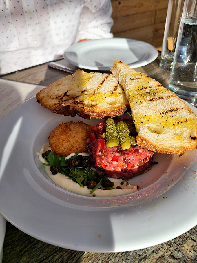 Steak tartare that reminds you why humans discovered fire but sometimes wisely choose to ignore it.
