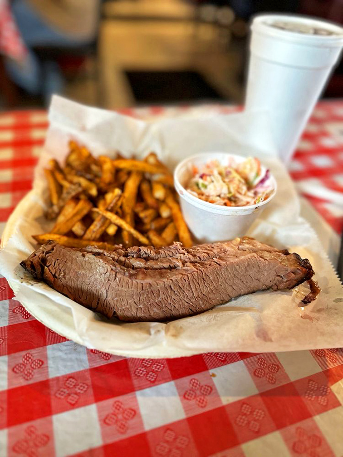 Brisket sliced so perfectly you could almost frame it. The smoke ring tells stories of overnight cooking sessions that most of us aren't dedicated enough to attempt.