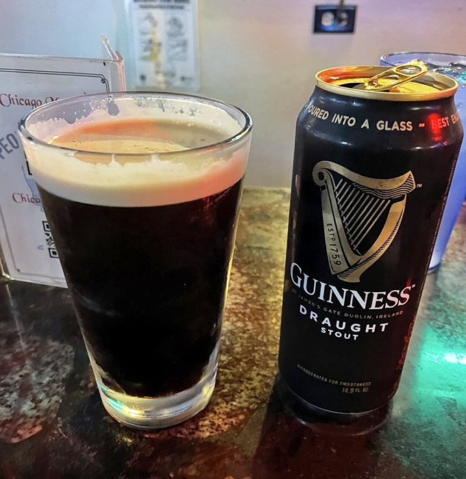 A perfect pour of Guinness stands ready to tame the fire of spicy toppings. Beer and pizza&mdash;some relationships are just meant to be.
