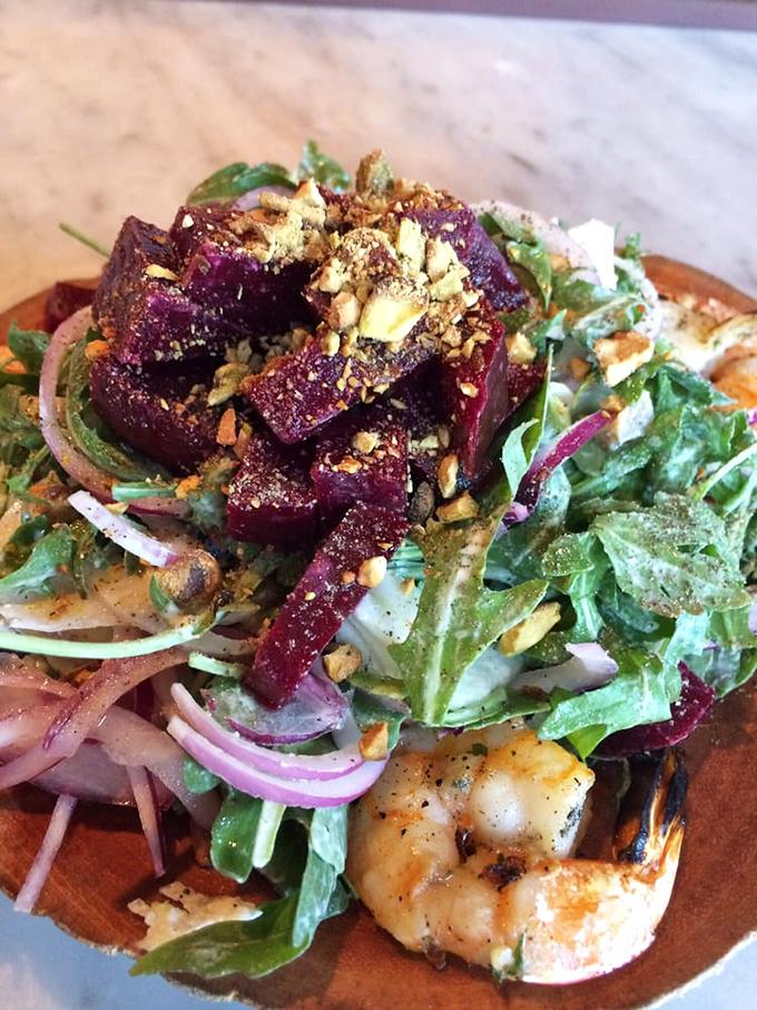 A beet salad that could convert even the most dedicated beet-skeptics. Those ruby jewels nestled among greens and what appears to be grilled shrimp.