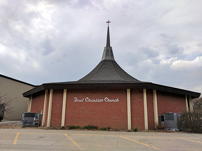 First Christian Church's distinctive spire reaches skyward, offering spiritual comfort in a town where faith remains an integral part of community life.