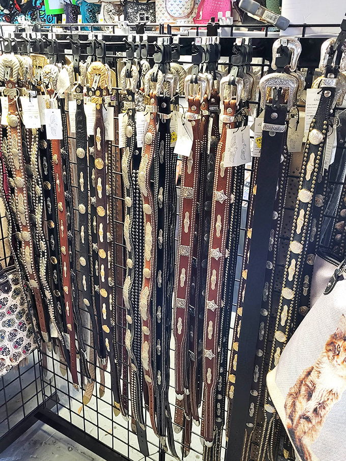 Western-style belts hang like trophies, each one telling a different story and waiting for its next chapter.