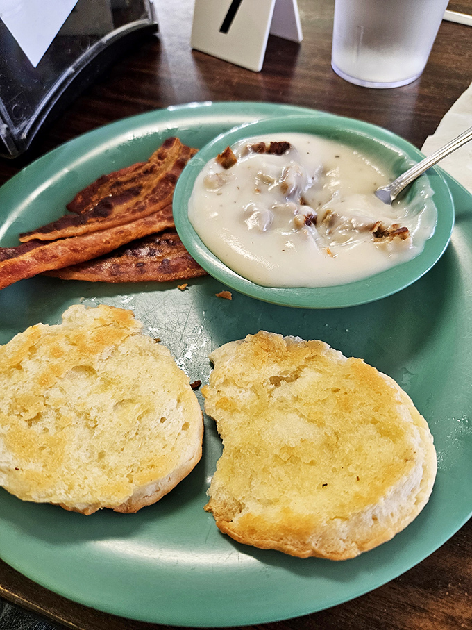 Biscuits that could float away if not anchored by that pool of sausage gravy. Add crispy bacon and you've got the breakfast trifecta of happiness.