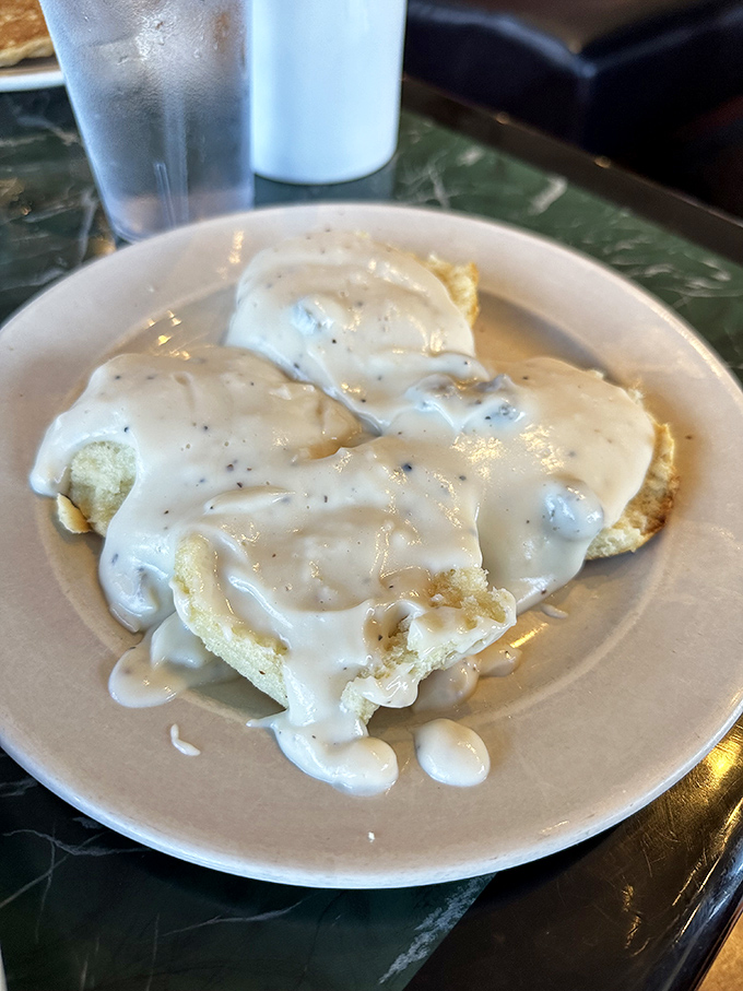 Biscuits swimming in creamy pepper gravy&mdash;a Southern tradition that's worth every single delicious calorie and food coma that follows.