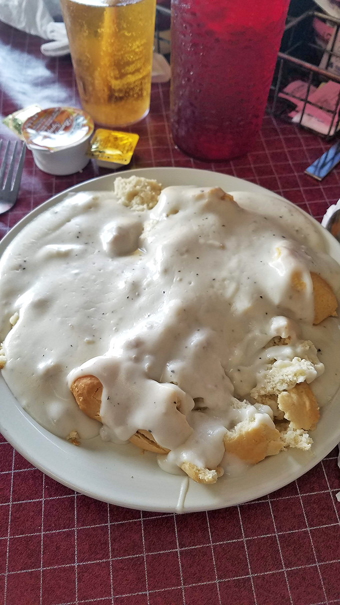 Biscuits and gravy so comforting they should be prescribed by therapists. That gravy blanket isn't just covering breakfast&mdash;it's tucking it in.