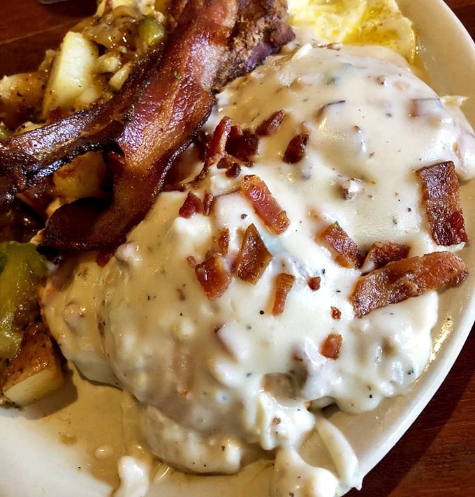 Breakfast of champions: a mountain of biscuits and gravy with bacon standing guard. Your cardiologist just felt a disturbance in the force.
