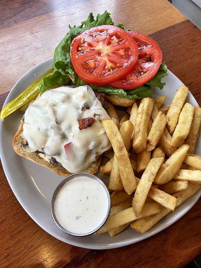 This burger and fries combo isn't just lunch&mdash;it's edible architecture, with melted cheese as the structural support.