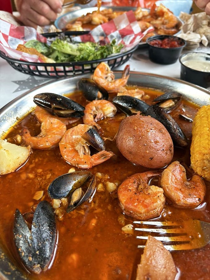 A spicy seafood symphony where mussels and shrimp perform in a sauce so good you'll be tempted to drink it with a straw.