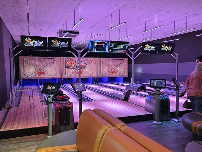The bowling alley glows with neon promise &ndash; because nothing says "I just came for milk" like rolling a perfect strike in the middle of your shopping trip.