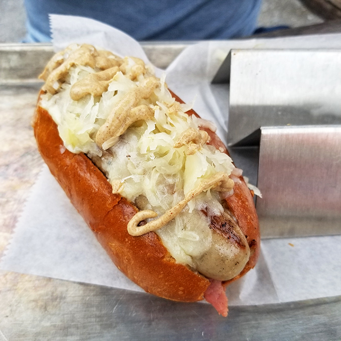 This bratwurst has more layers than your favorite HBO drama. Sauerkraut, melted cheese, and a perfectly toasted bun create a symphony of textures and flavors.
