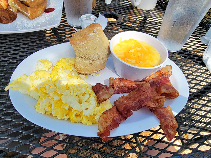 The breakfast plate that launched a thousand road trips &ndash; eggs, bacon, grits, and a biscuit that's worth setting your alarm for.