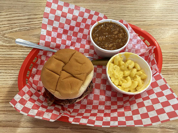 The holy trinity of BBQ happiness: pulled meat, soft bun, and sides that don't know they're supposed to be supporting characters.