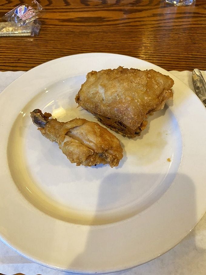 Broasted chicken so perfectly golden it belongs in Fort Knox, with a crunch that announces its arrival before your first bite.