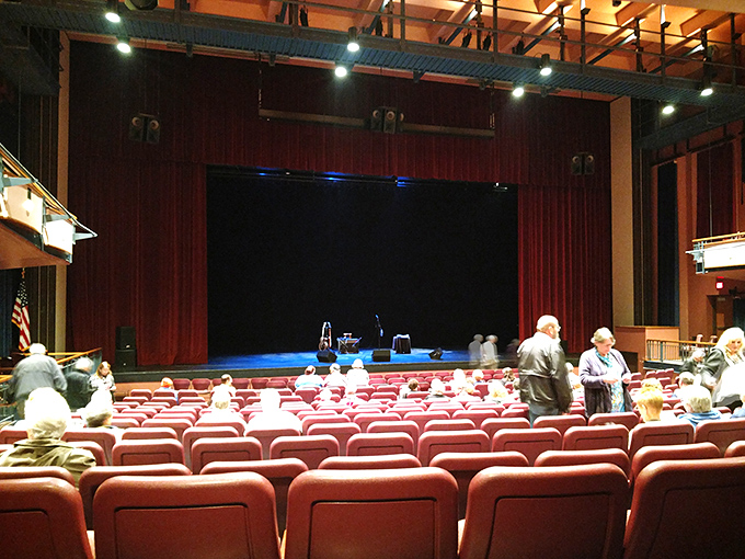 Theater seats ready for performances that bring culture and entertainment to a community that values both quality and accessibility equally.