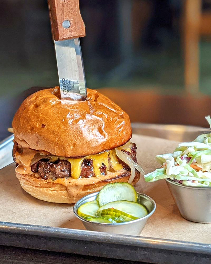 A burger that's not playing around&mdash;knife-stabbed for dramatic effect and oozing with melted cheese and smoky attitude.
