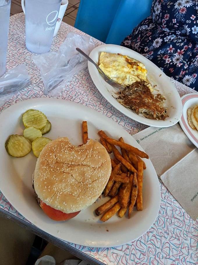 The classic diner burger and fries combo&mdash;proving that sometimes the simplest pleasures require two hands and zero pretension.