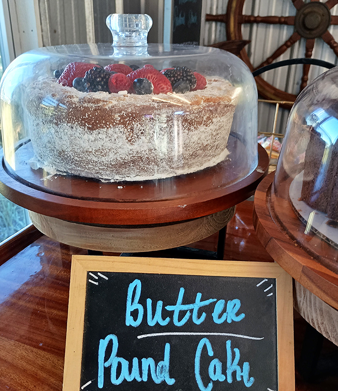 Butter pound cake under glass – displayed like the crown jewel it is. The berries on top are just showing off at this point.