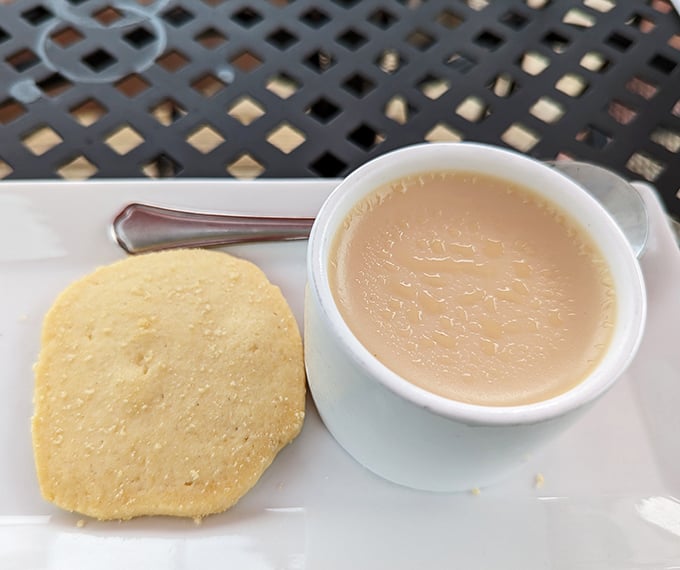 A simple cup of butterscotch pudding with a cornbread cookie &ndash; proof that sometimes the most humble desserts deliver the most profound satisfaction.