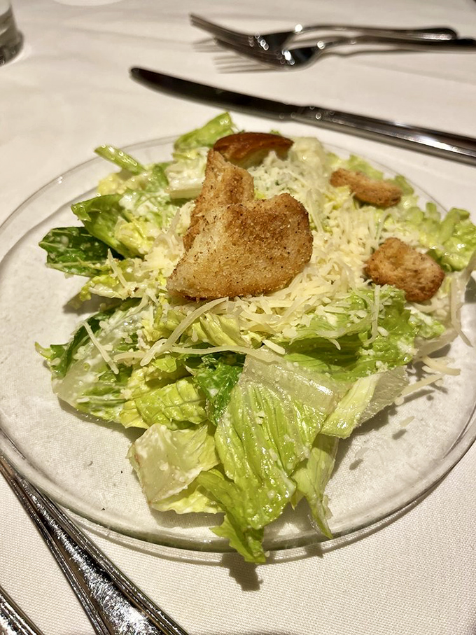 A proper Caesar salad&mdash;crisp, cheesy, with croutons that crunch like autumn leaves. Simple perfection that never goes out of style.
