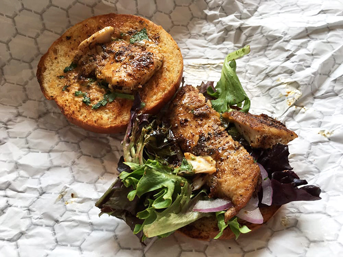 The Cajun mahi sandwich brings the bayou to Philly. Those crispy edges and vibrant toppings are doing a happy dance on that sesame bun.