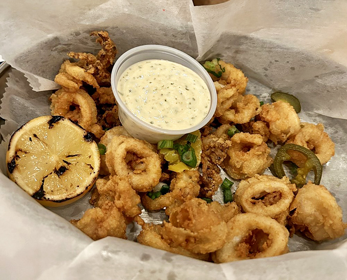 Crispy calamari that puts rubber band appetizers to shame &ndash; tender, perfectly seasoned, and worth every moment of anticipation.