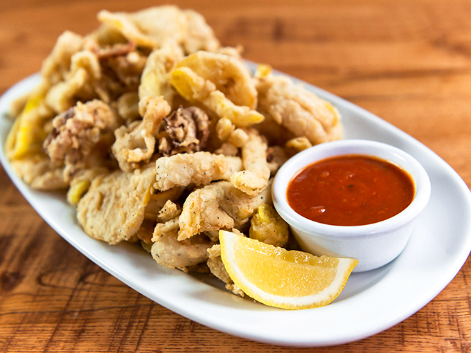Calamari so perfectly fried it might make you forget you're eating something with tentacles. The lemon wedge isn't just garnish &ndash; it's essential.