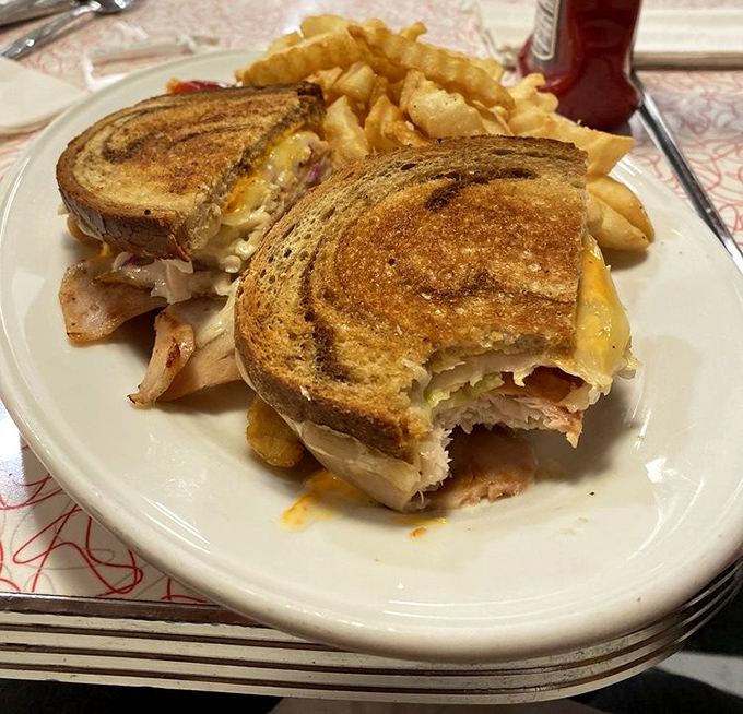 The California Reuben arrives grilled to perfection, because sometimes you need a sandwich that means business with every bite.