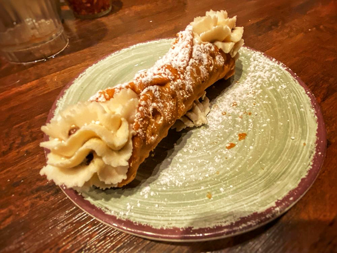 A cannoli that demands respect. That crispy shell and creamy filling create the kind of contrast that makes Italian grandmothers nod in approval.