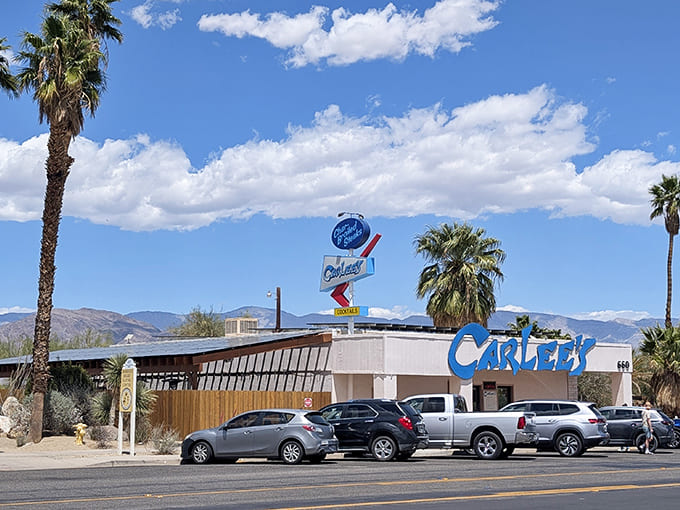 Carlee's Place stands as a desert institution where locals and visitors alike gather to swap stories beneath the iconic blue sign.