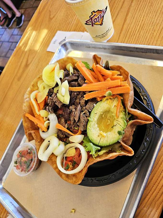 This tostada isn't just a meal, it's a California history lesson—where fresh avocado and carne asada create a borderless culinary democracy.