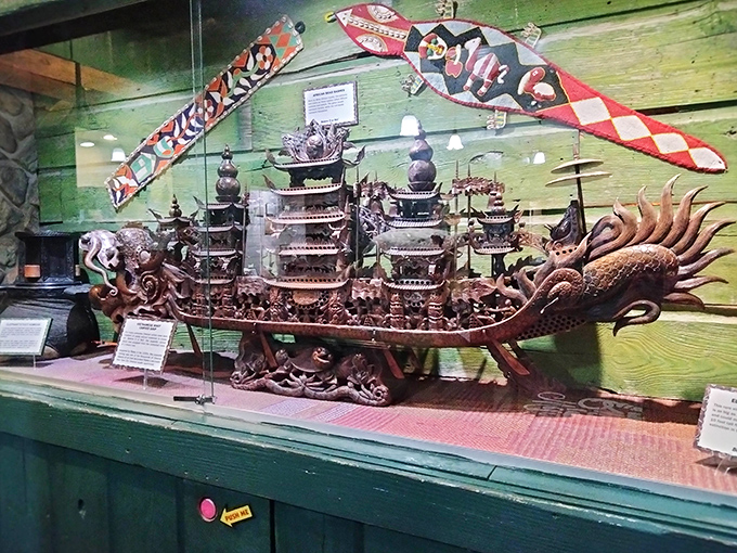 Exquisite craftsmanship meets mythological wonder in this intricate dragon boat carving. Centuries of tradition floating in a display case.