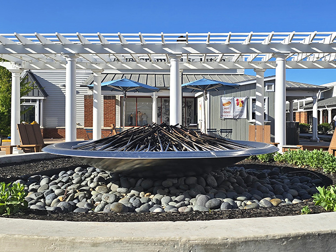 At Leesburg Premium Outlets, modern design meets open-air comfort &mdash; a sleek plaza centerpiece offering shoppers a stylish spot to pause between finds.
