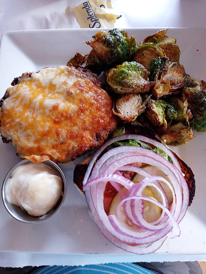 This burger and its perfectly crisped companions remind us that simple pleasures, when done right, can outshine the fanciest culinary gymnastics.
