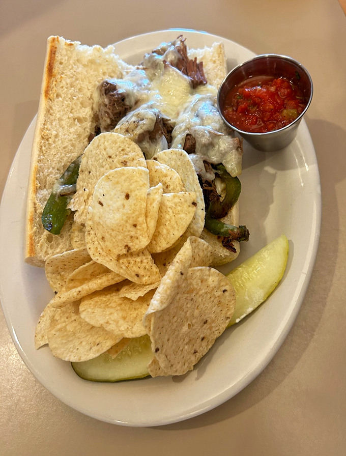 Melted cheese cascading over tender meat with a side of tortilla chips. This sandwich doesn't just satisfy hunger&mdash;it obliterates it.