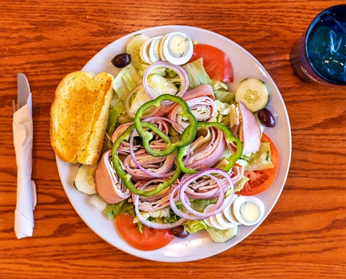 A chef salad arranged with the precision of a Swiss watchmaker&mdash;where every bite delivers the perfect balance of fresh ingredients.