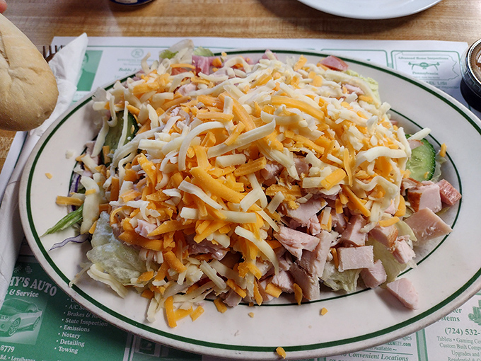 A chef salad that actually makes eating healthy feel like cheating. That mountain of cheese and ham atop crisp lettuce is diner artistry.