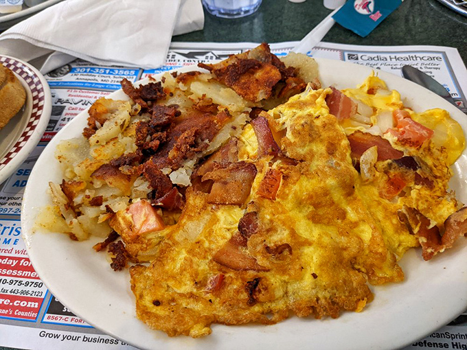 This omelet doesn't just contain bacon&mdash;it embraces it, celebrates it, throws it a parade alongside perfectly crisped home fries. 