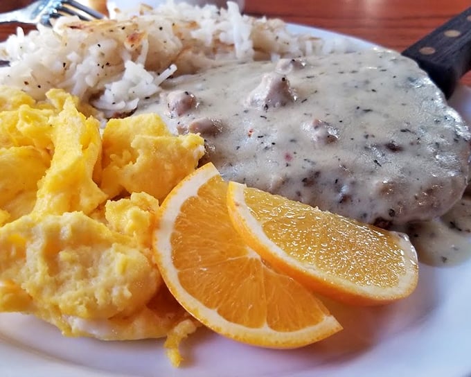 Chicken Fried Steak: Where comfort food meets cardiac adventure. This plate of golden-crusted goodness is like a warm, gravy-covered hug for your stomach. 